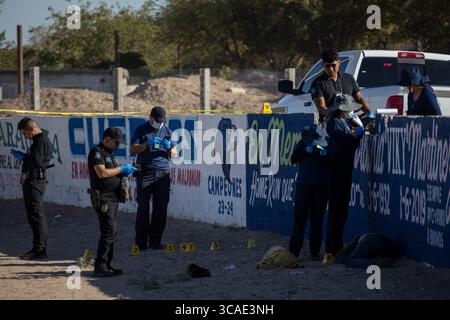 Workers and law enforcement examine debris from a semi-truck after a ...