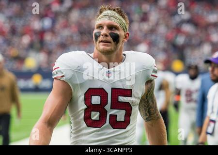 Arizona Cardinals tight end Trey McBride, right, runs with the ball ...