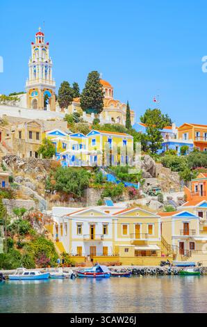 Colourful houses and Evangelismos church at the Harani Bay, Gialos ...