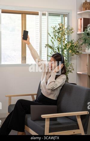 Celebrating Joy at Home While Listening to Music in Cozy Living Room ...