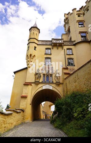 The yellow castle Hohenschwangau Castle nestled in the Bavarian forest ...