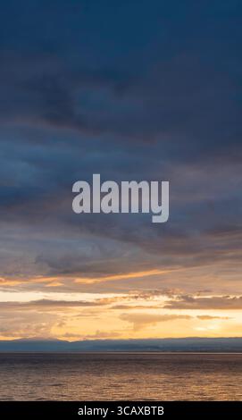 A mid summer sky over Lac Leman, Switzerland. Multi layered clouds ...