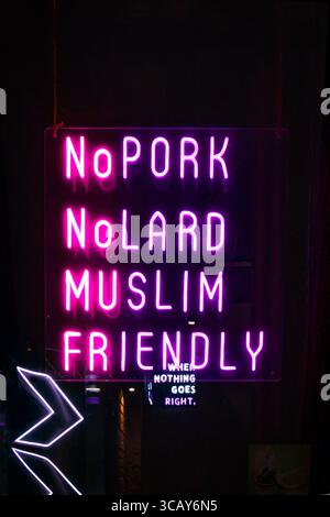 Halal sign and restaurant display in busy area Stock Photo - Alamy