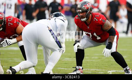 Tampa Bay Buccaneers guard Cody Mauch (69) talks to guard Ben Scott (66 ...