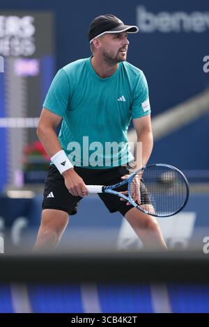 Neal Skupski of Great Britain looks on during the semi-final doubles ...
