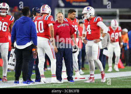 New England Patriots quarterback Mac Jones (10) warms up during an NFL ...