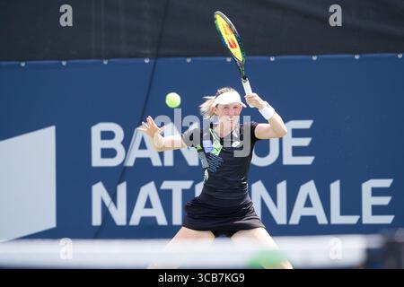 Storm Hunter of Australia hits a forehand to Malene Helgo of Norway ...