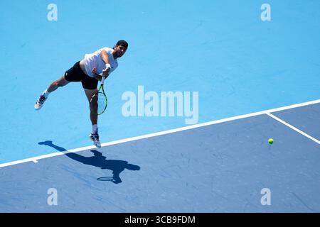 Jacob Fearnley, of Great Britain, serves to Alexander Zverev, of ...