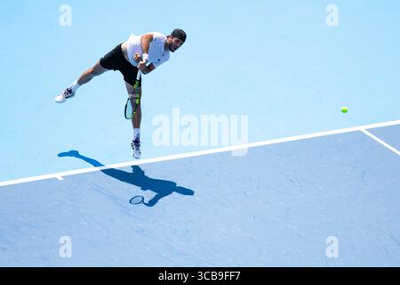 Jacob Fearnley, of Great Britain, serves to Alexander Zverev, of ...