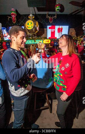 glad business couple celebrate christmas isolated on white. corporate ...