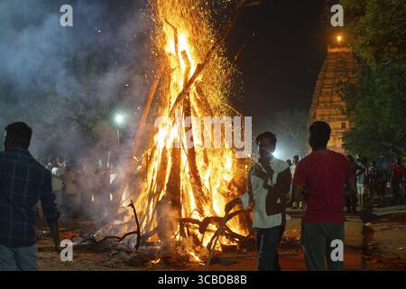 Hindu celebrating Holika Dahan, ritual bonfire on the evening before ...