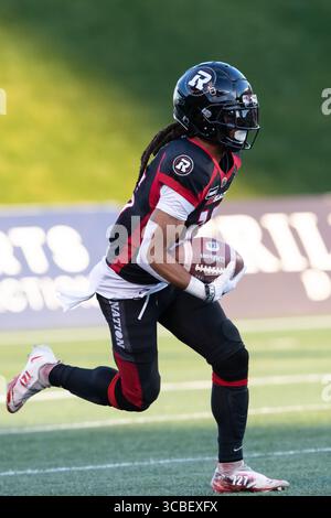 October 29, 2022: Ottawa Redblacks quarterback Tyrie Adams (7) escapes ...