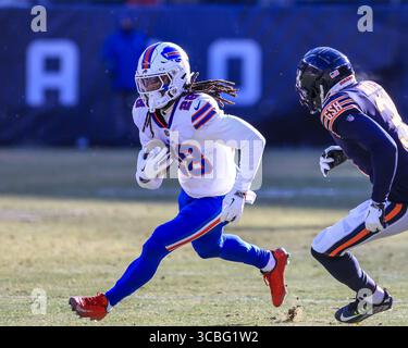 Buffalo Bills' James Cook runs during the first half of an NFL football ...