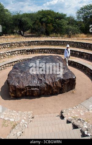 A woman tourist views the Hoba meteorite, the largest known meteorite ...