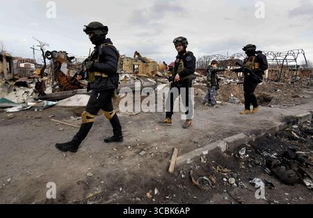 Children walk in Bucha on the outskirts of Kyiv, Ukraine, Friday, April ...