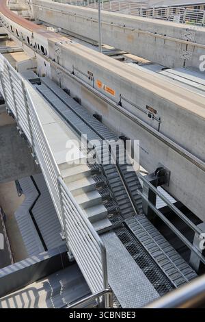 Steel emergency exit ladder on renovated factory building with brick ...