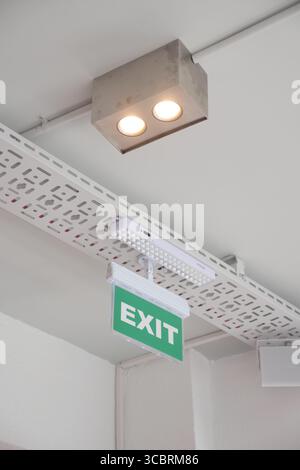exit sign under the ceiling Stock Photo - Alamy