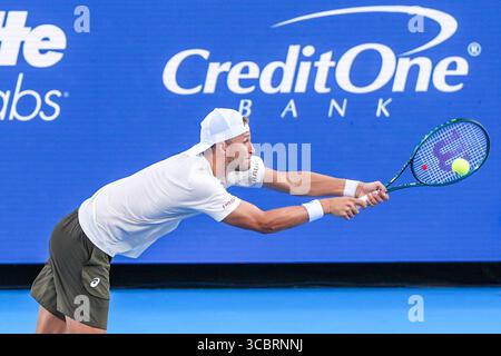 Leandro Riedi, of Switzerland, returns a shot to Francisco Cerundolo ...