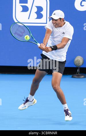 Leandro Riedi, of Switzerland, returns a shot to Francisco Cerundolo ...
