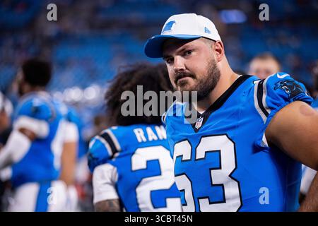 Carolina Panthers center Austin Corbett (63) and quarterback Bryce ...
