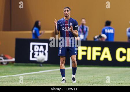 Achraf Hakimi of Paris Saint-Germain FC celebrates with the trophy ...