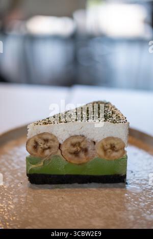 Banoffee pie dessert served on a plate in warm sunlight, highlighting ...