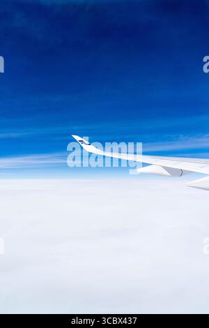 The Finnair plane flying in the sky Stock Photo - Alamy
