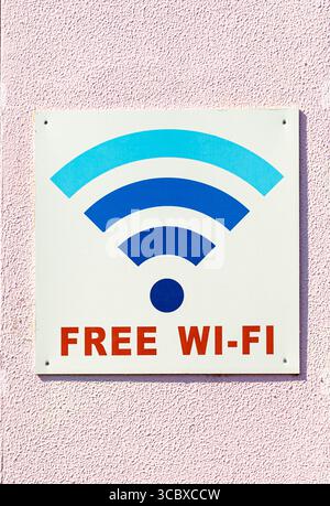 Wifi sign. Blue and white wifi sign board on the green background in ...