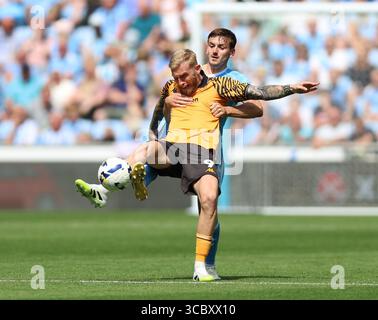 Hull City's Oliver McBurnie (left) celebrates with Ryan Giles after ...