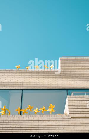 Yellow pinwheel and building. minimalism architecture Stock Photo - Alamy