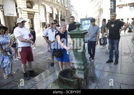 Milan, Heat Wave, Tourists in the Historic Center, Man Rinses His Face ...