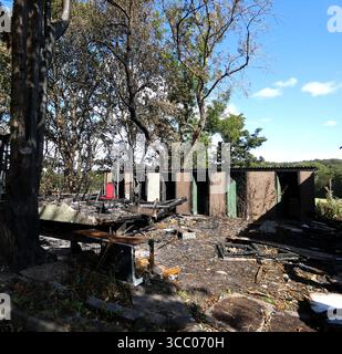 Remains of a burned-out building on Lake Avenue in Altadena, California ...