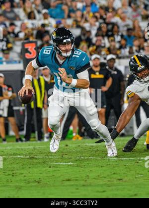 Jacksonville Jaguars quarterback John Wolford (18) runs with the ...