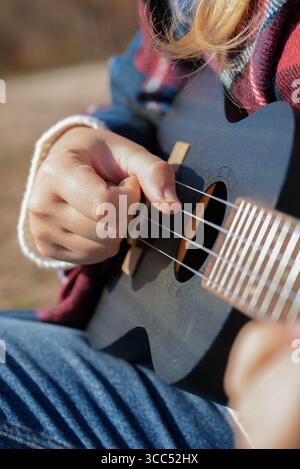portrait of a girl with a guitar in her hands Stock Photo - Alamy