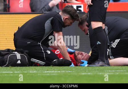 Aberdeen's Nicky Devlin receives treatment during the William Hill ...