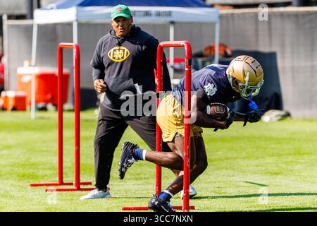 Notre Dame running back Jeremiyah Love (4) rushes against Bosie State's Davon Banks (4) and ...