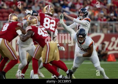 Denver Broncos punter Jeremy Crawshaw (16) in the first half of an NFL football game Thursday ...
