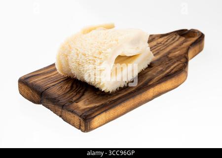 Raw honeycomb tripe chunks on a wooden board - second beef stomach ...