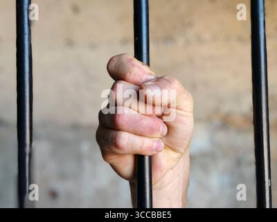 prisoner looking out of the window of a prison cell Stock Photo - Alamy
