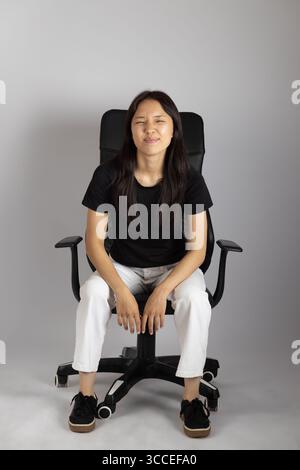 Millennial black businesswoman sitting at computer desk and smiling at ...