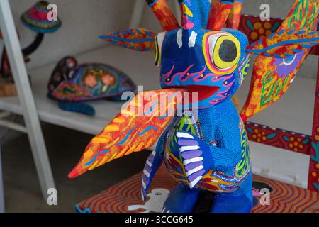 Fire-breathing alebrije creaature in an artisan's shop / workshop in ...