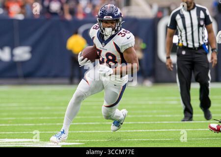 Denver Broncos running back Jaleel McLaughlin (38) slips past Kansas ...