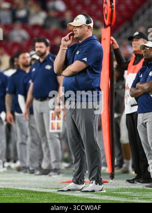 Georgia Tech head coach Brent Key, right, greets his family after ...