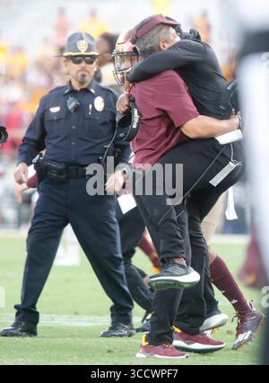 Arizona State Interim head coach Shaun Aguano warms up before an NCAA ...
