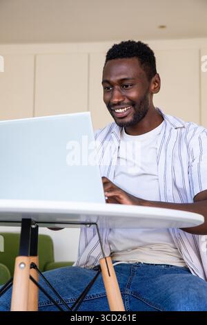 Working remotely in a cozy home office surrounded by greenery while on ...