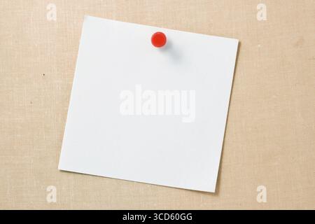 Note white paper tacked on a wall Stock Photo - Alamy