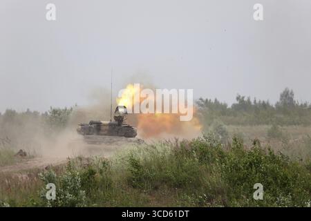 Fire and smoke from a tank shot during training at the training ground ...