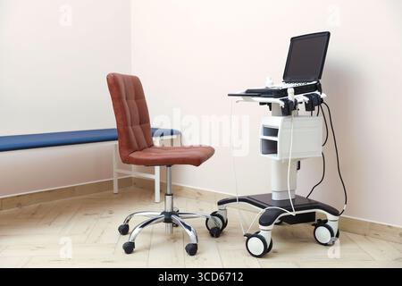 Modern ultrasound machine, chair and examination bed in clinic Stock ...