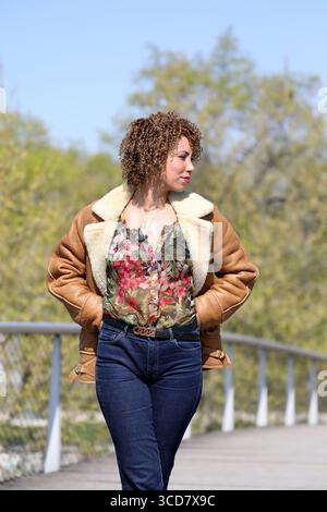 Photo of positive nice good mood girl with curly hairstyle wear red ...