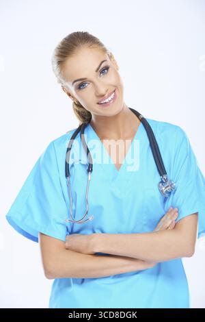 Nurse with stethoscope on light blue background Stock Photo - Alamy